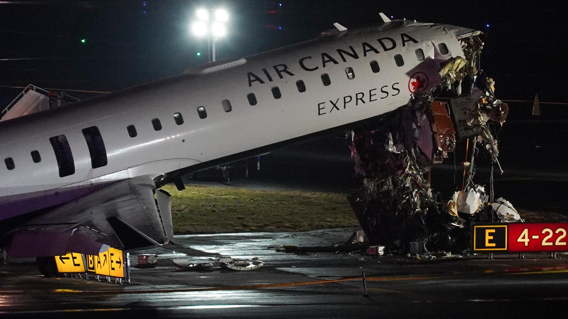 Flight attendant found buckled into seat outside plane after LaGuardia ...