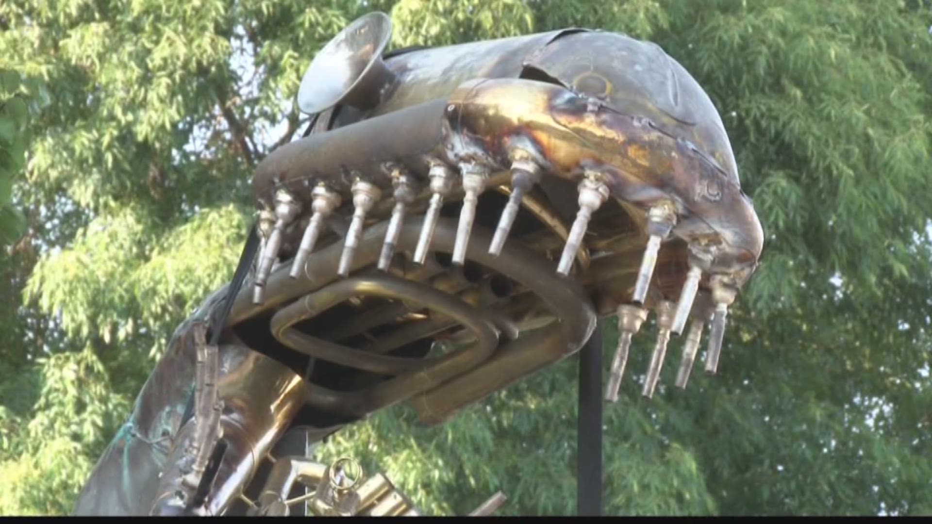 Man creats dinosaur out of brass instruments | abc10.com