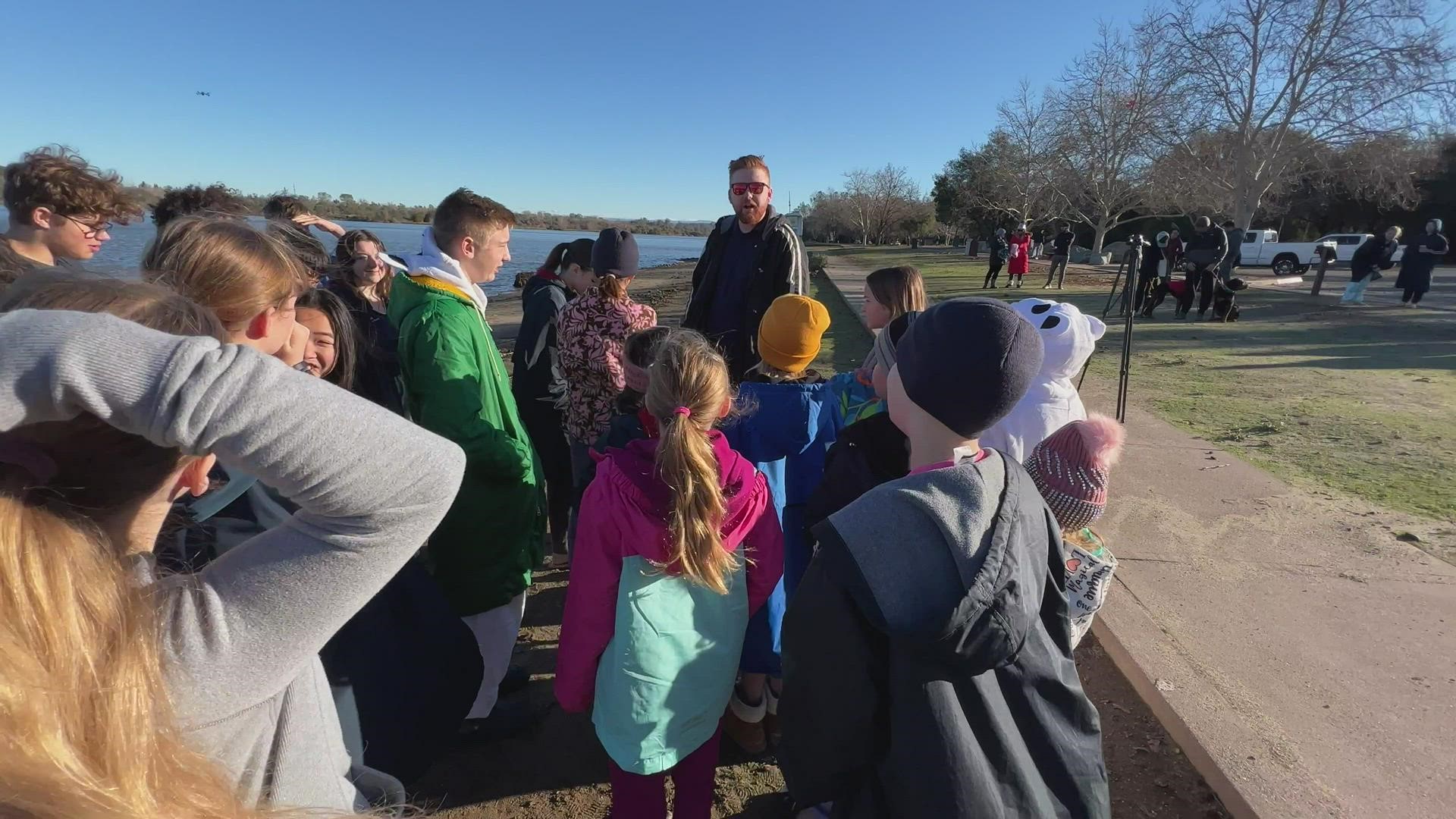 Fair Oaks swim team jumps in icy cold water in decades-old New Year's ...