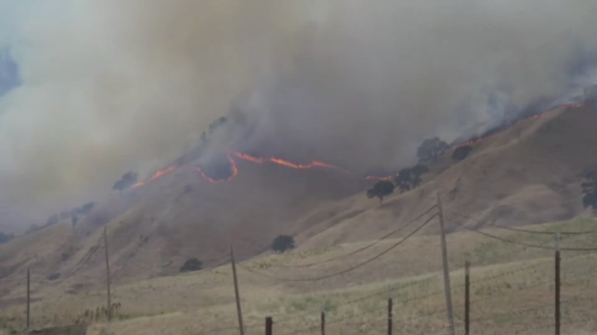 Large grass fire near Putah Creek prompts road closures | abc10.com