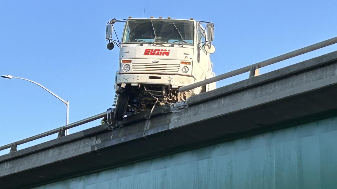Street sweeper hanging over side of Sacramento freeway | abc10.com