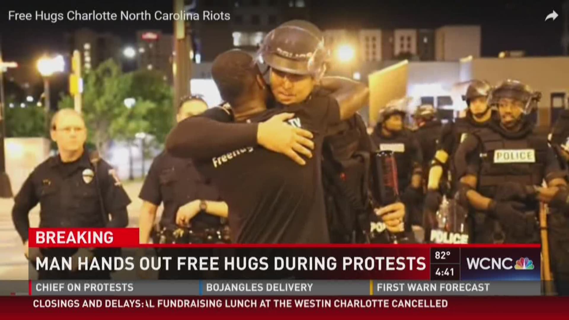 Man gives police in riot gear hugs | abc10.com